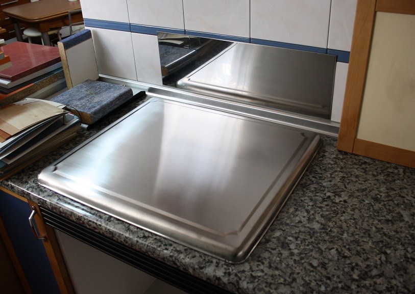 Plaque de protection pour plaque de cuisson